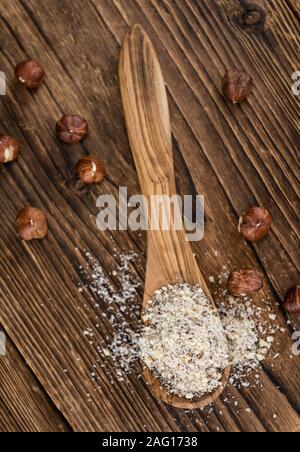 Grounded Hazelnuts (selective focus; close-up shot) on a slate slab ...