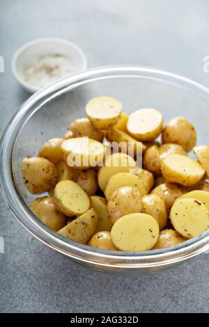 Baked small baby potato with herbs and spices Stock Photo - Alamy