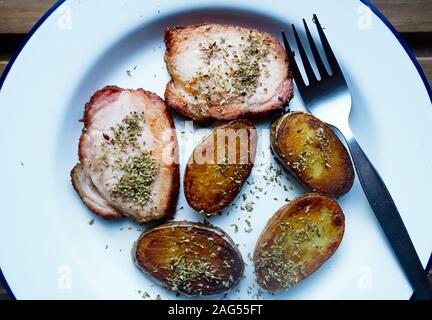 Greek Cuisine. Smoked Pork Fillet Apaki with Rice, Roast Potatoes and ...