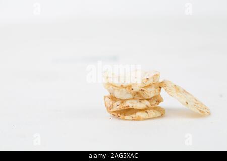 Closeup shot of a stack of pignolia isolated on a white background ...