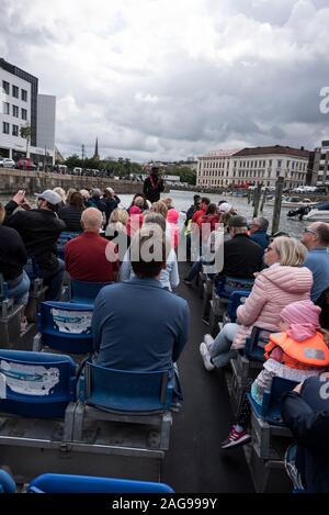 Tourists on the sightseeing boat Paddan in Göta älv. Here at the ...