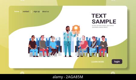 steward explaining for passengers how to use jacket life vest in ...