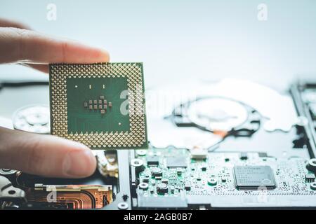 Male hand is holding a cpu, close up; Computer technology Stock Photo ...