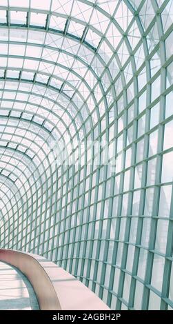 Vertical shot of a hallway with white walls and old chandeliers on the ...