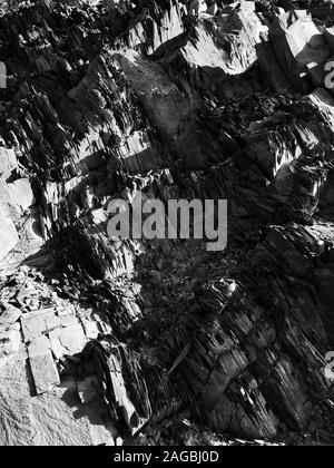 Vertical grey scale shot beautiful layers of old rocks Stock Photo - Alamy