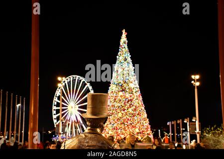 National Harbor Christmas tree with Ferris wheel in background Stock ...
