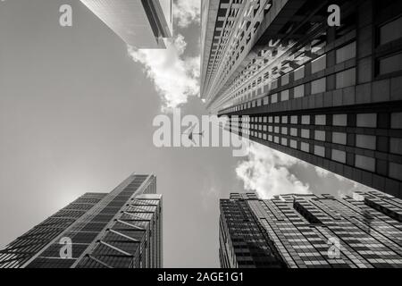 A greyscale high angle shot of spiral stairs with metal fences Stock ...