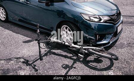 Serious Car accident. Car hit and ran over bicycle on street. Car ...