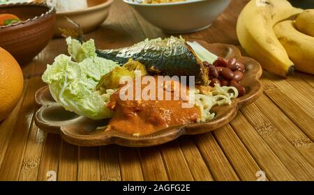 Kenkey with fried fish and chili pepper, Ghanaian cuisine, Traditional assorted African dishes ...