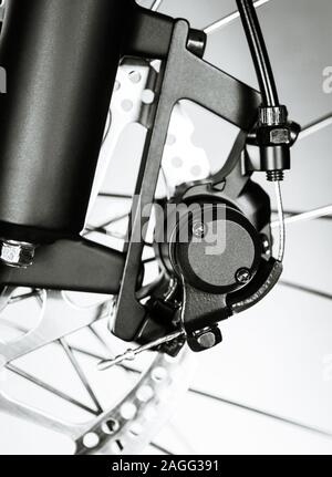 Mountain bike front wheel with mechanical disc brake on white ...