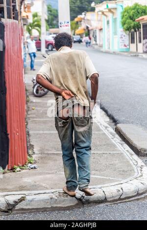 dramatic image of a poverty stricken dominican man walking down the ...