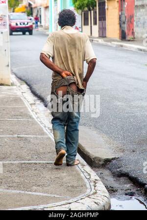 dramatic image of a poverty stricken dominican man walking down the ...
