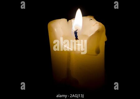 Closeup shot of a candle with black background Stock Photo - Alamy