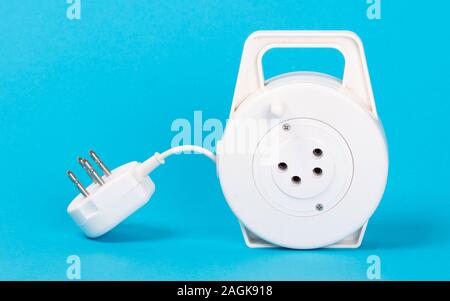 Retractable phone cord isolated on blue background Stock Photo - Alamy