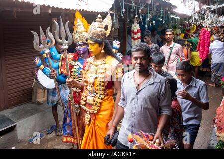 Group dressed as Hindu deities walking through Goubert Market during ...