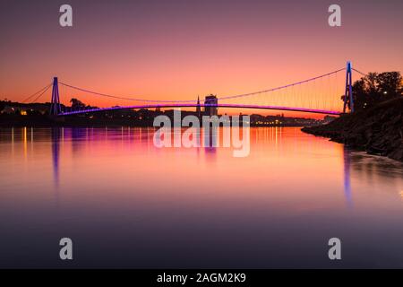 Osijek sunset panorama. Pedestrian bridge over Drava river at sunset ...