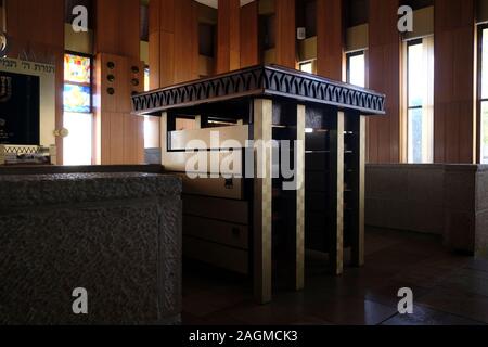Interior of a synagogue with bimah in middle. Synagogue is Jewish house ...