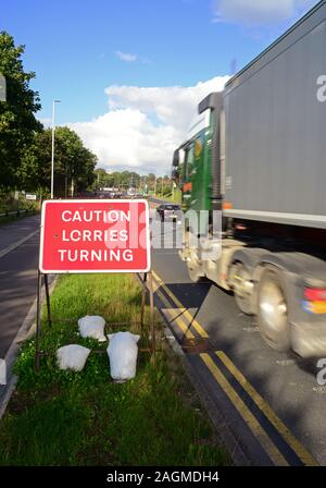 Road sign: caution lorries turning Stock Photo - Alamy