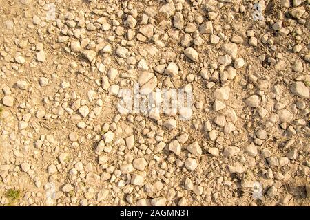 A collection of random sized stones on the ground, which will make a ...