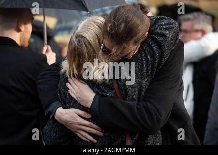 Mourners embrace outside following the funeral of London Bridge terror ...