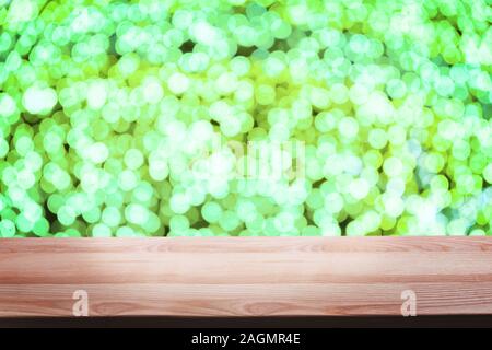 Empty wooden table with festive bokeh lights on colorful background for ...
