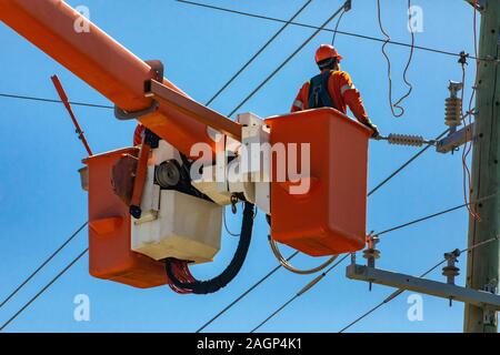 a workman working at height wearing an high visibility vest without any ...