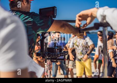 Professional steadicam operator uses a 3-axis camera stabilizer system ...