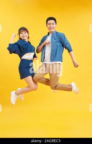Full length body size view of attractive cheerful couple jumping having ...