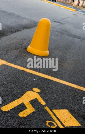 yellow parking symbol for loading and unloading area on the pavement ...