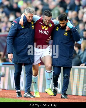 Aston Villa's John McGinn (centre) speaks with referee Andrew Madley ...