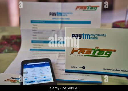 Fast Tag along with a mobile phone on the table, the application form ...