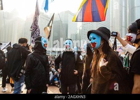 Protesters look on during speeches at the National Day of Action ...