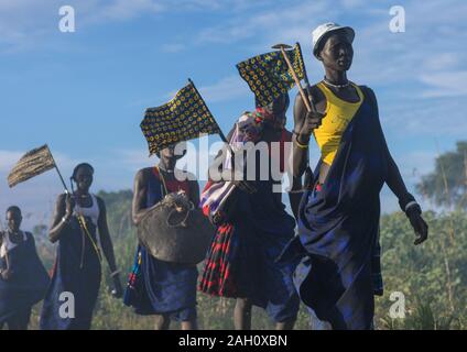 Mundari tribe women marching in line while celebrating a wedding ...