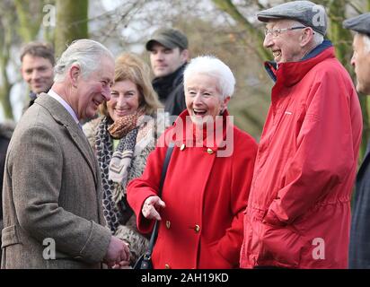The Prince of Wales speaks with local residents during a visit to the ...