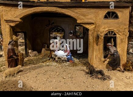 Nativity scene showing the village of Bethlehem with details from the ...