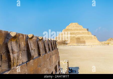 [Step Pyramid] and frieze of stone carved cobra heads on South Tomb ...