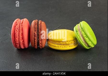 Delicious four colored macaroons on a white background Stock Photo - Alamy