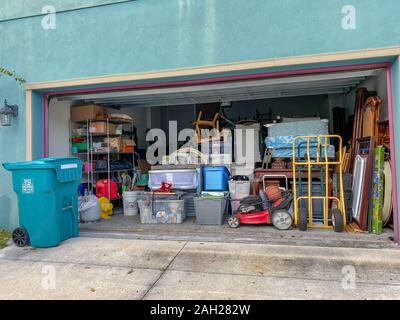 Messy cluttered junk filled suburban garage shelves with vintage ...