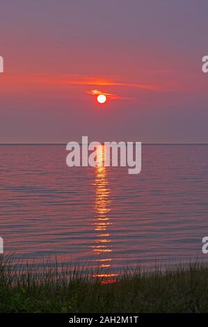 Serene Sunset Over Lake Michigan with Moon Glimpse Stock Photo - Alamy