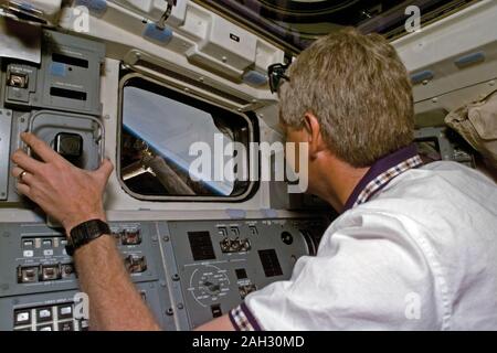 Space Shuttle Discoverys aft cargo bay its vertical stabilizer and ...