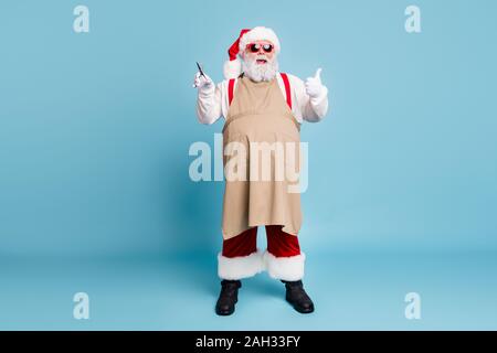 Santa Claus holding his big belly, full body, isolated on white ...