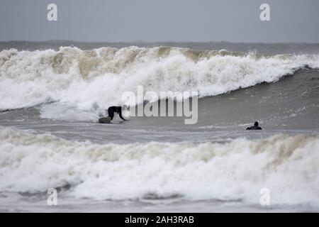 Welsh surfing champion and Wave Surf Coach, Emily Williams, (left ...