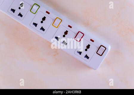 Modern multifunction electric switch with socket on white wal in the ...