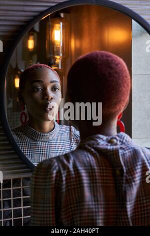 Woman kissing her reflection in the looking glass , Clothing & dress ...