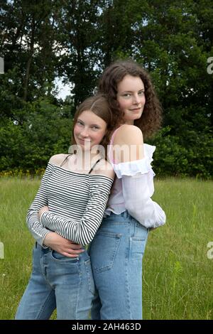 Close-up image of two attractive young people having a business meeting ...