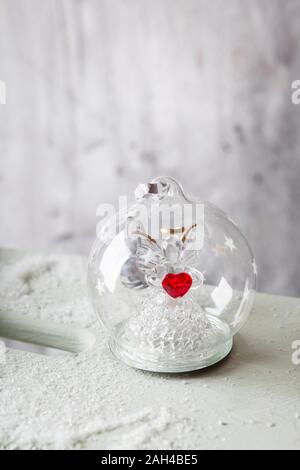 Glass angel with red heart Christmas decoration, gold color ball and ...