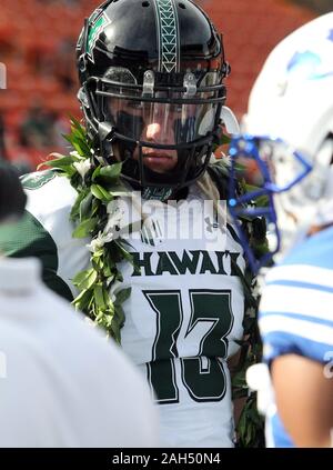 Hawaii quarterback Cole McDonald (13) gains yards over Duquesne during ...