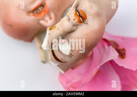 Broken doll faces isolated on white background - conceptual image Stock ...