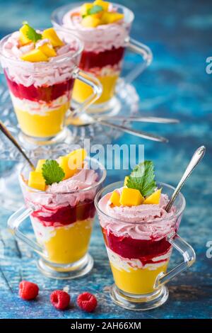 raspberry and mango layered dessert Stock Photo - Alamy
