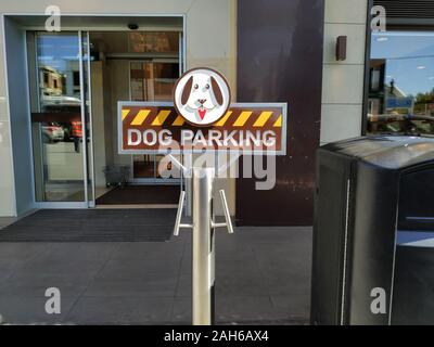 Dog parking sign outside a shop, Italy Stock Photo: 222763069 - Alamy
